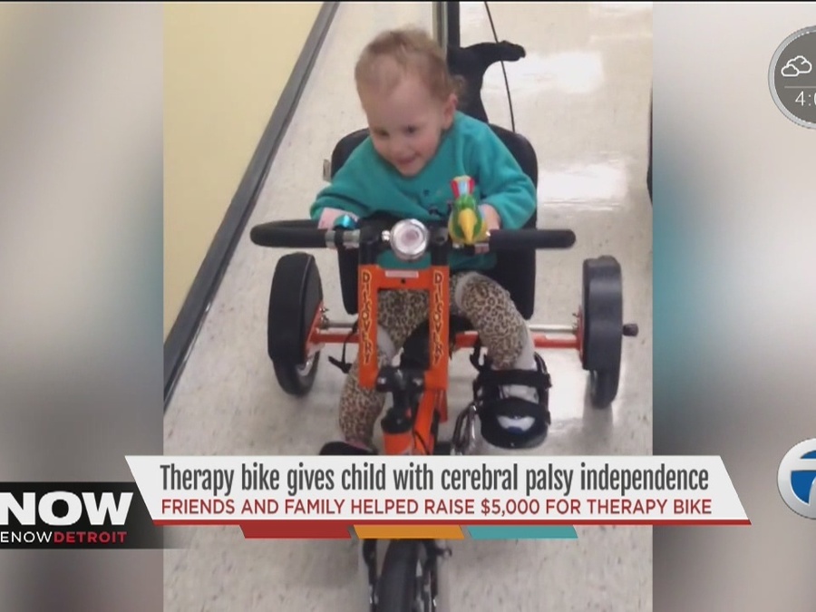 Child with cerebral palsy thriving with special therapy bicycle - WXYZ.com